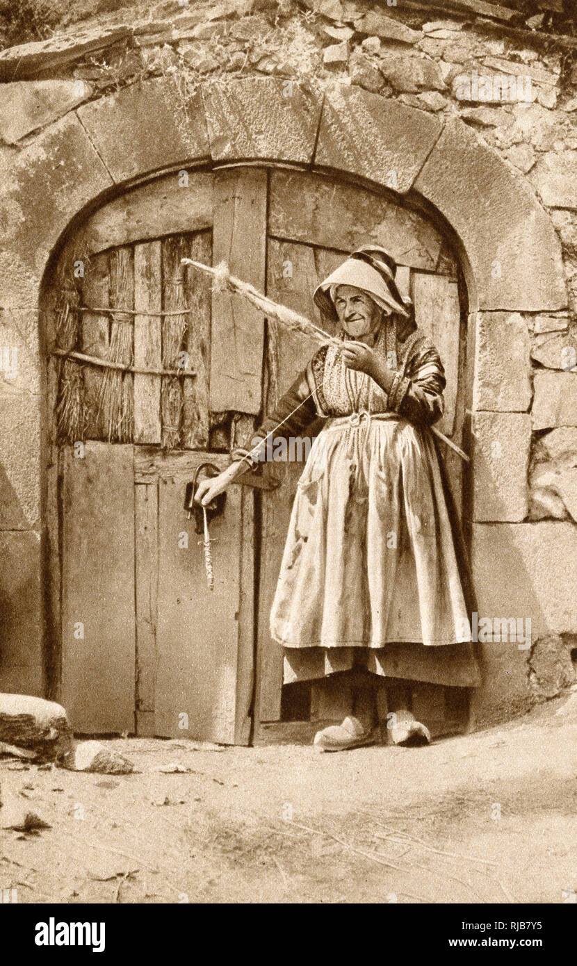 Woman With Distaff High Resolution Stock Photography and Images - Alamy
