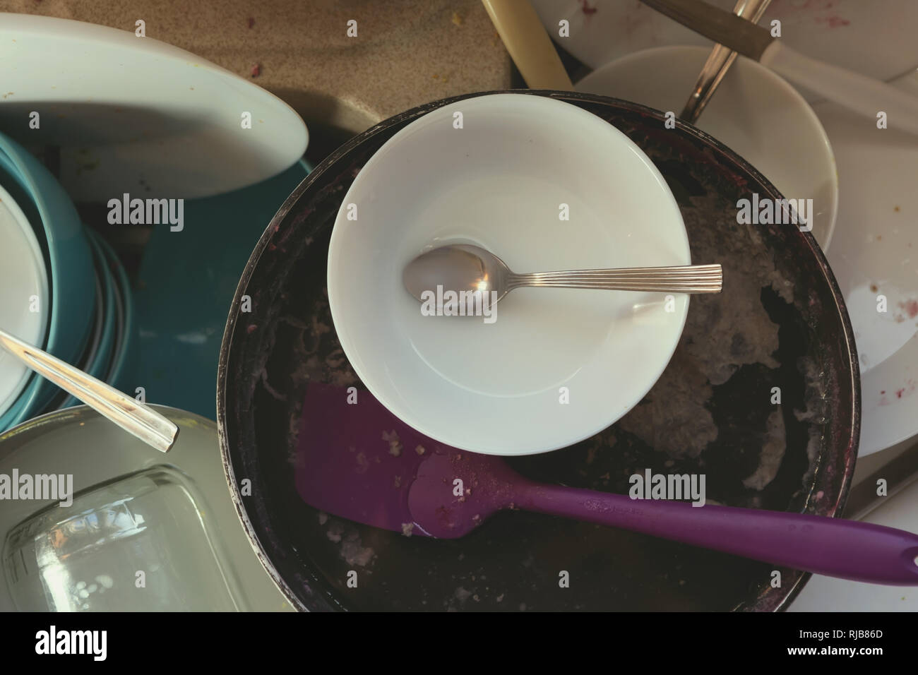 A Messy Pile of Dirty Dishes And Utensils In Kitchen Sink Stock Photo ...