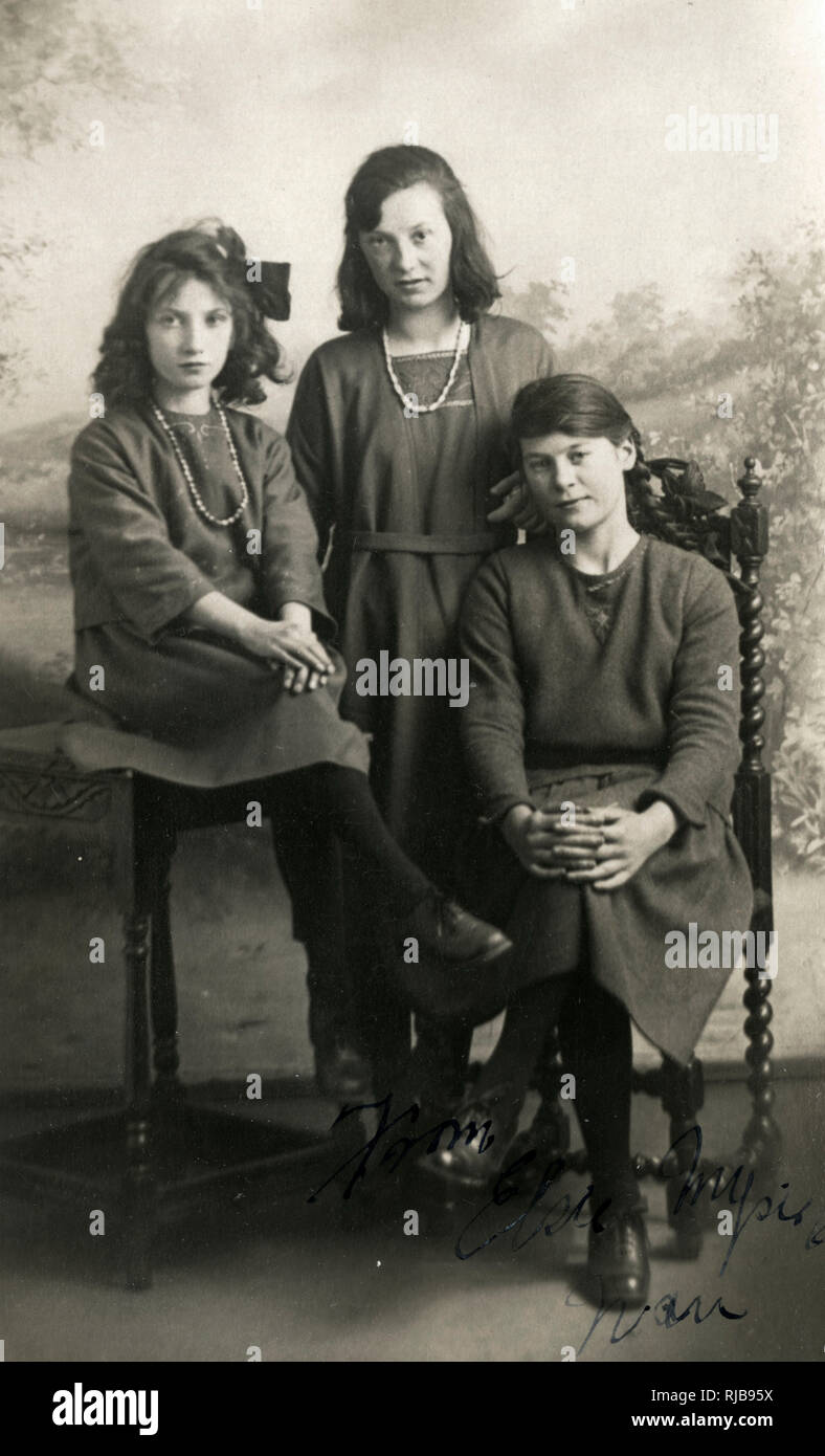 Three young ladies pose for a formal studio portrait Stock Photo - Alamy