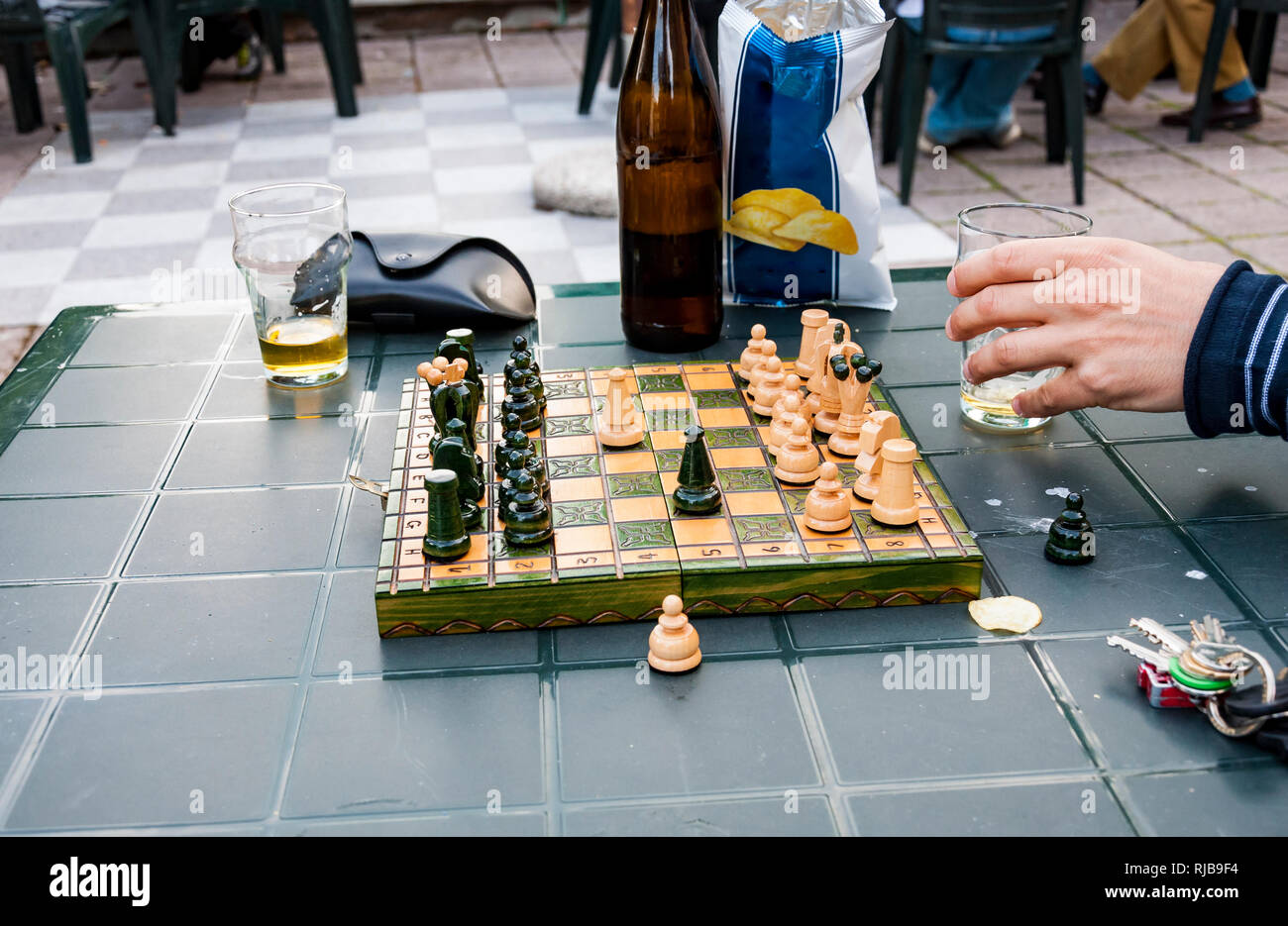 Adult people play chess game in a small town in Italy, reggio Emilia ...