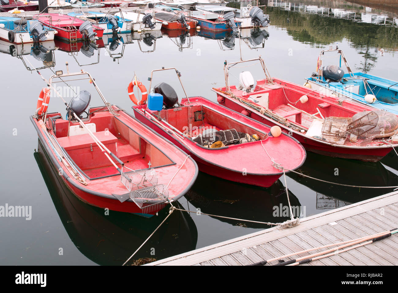 Clam acuaculture boats on pier and some clam digging tools. Rias baixas ...