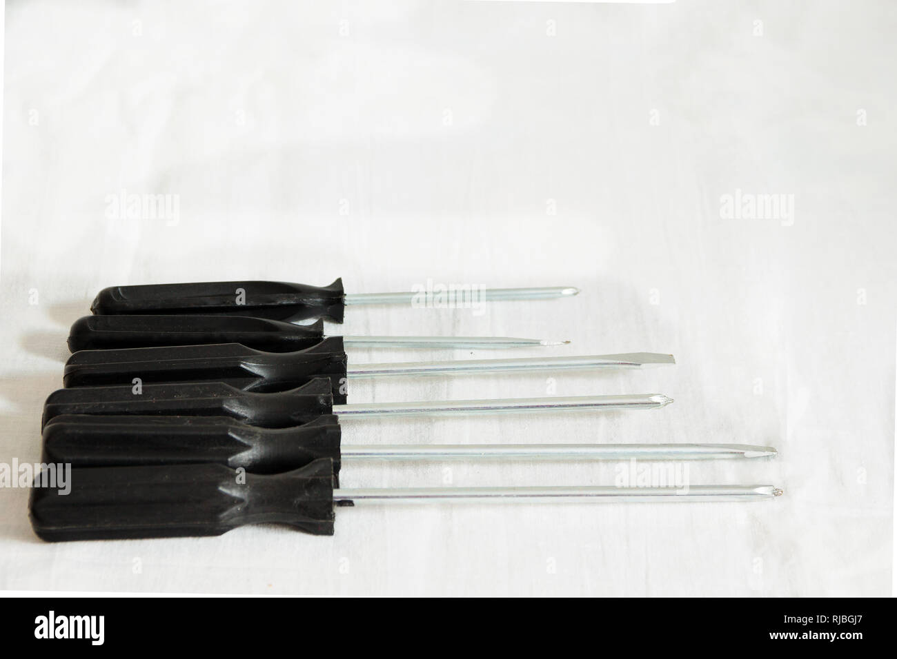 Set of screwdrivers of different length with cross and straight tip ...