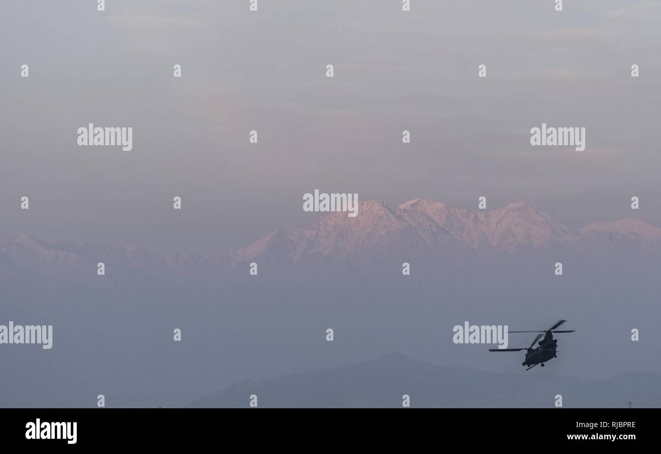 A CH-47 Chinook takes off from the ramp at Bagram Air Field ...