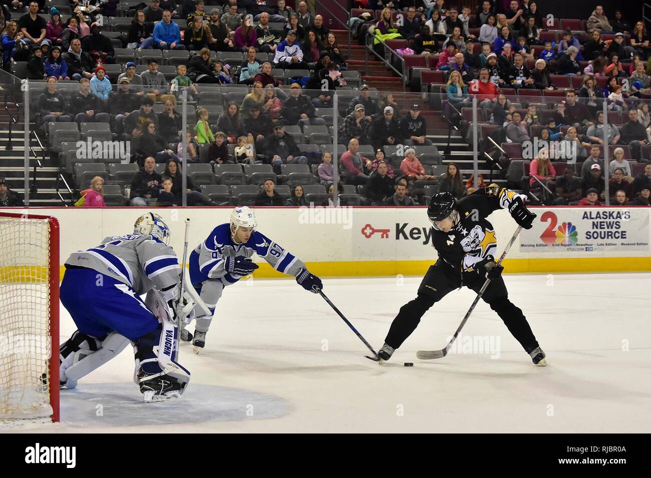 Army’s Rick Metcalf of Lakeville, Minnesota, works to get a shot past ...