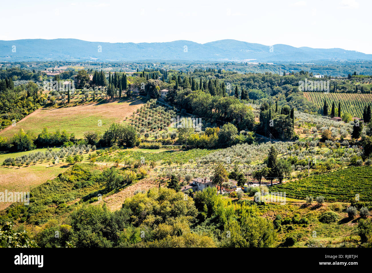 San Gimignano, Italy landscape of rolling hills with vineyards ...