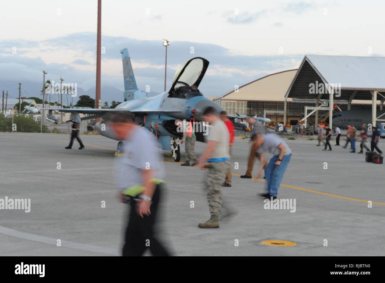 U.S. Air Force Airmen and civilian employees conduct a foreign object ...
