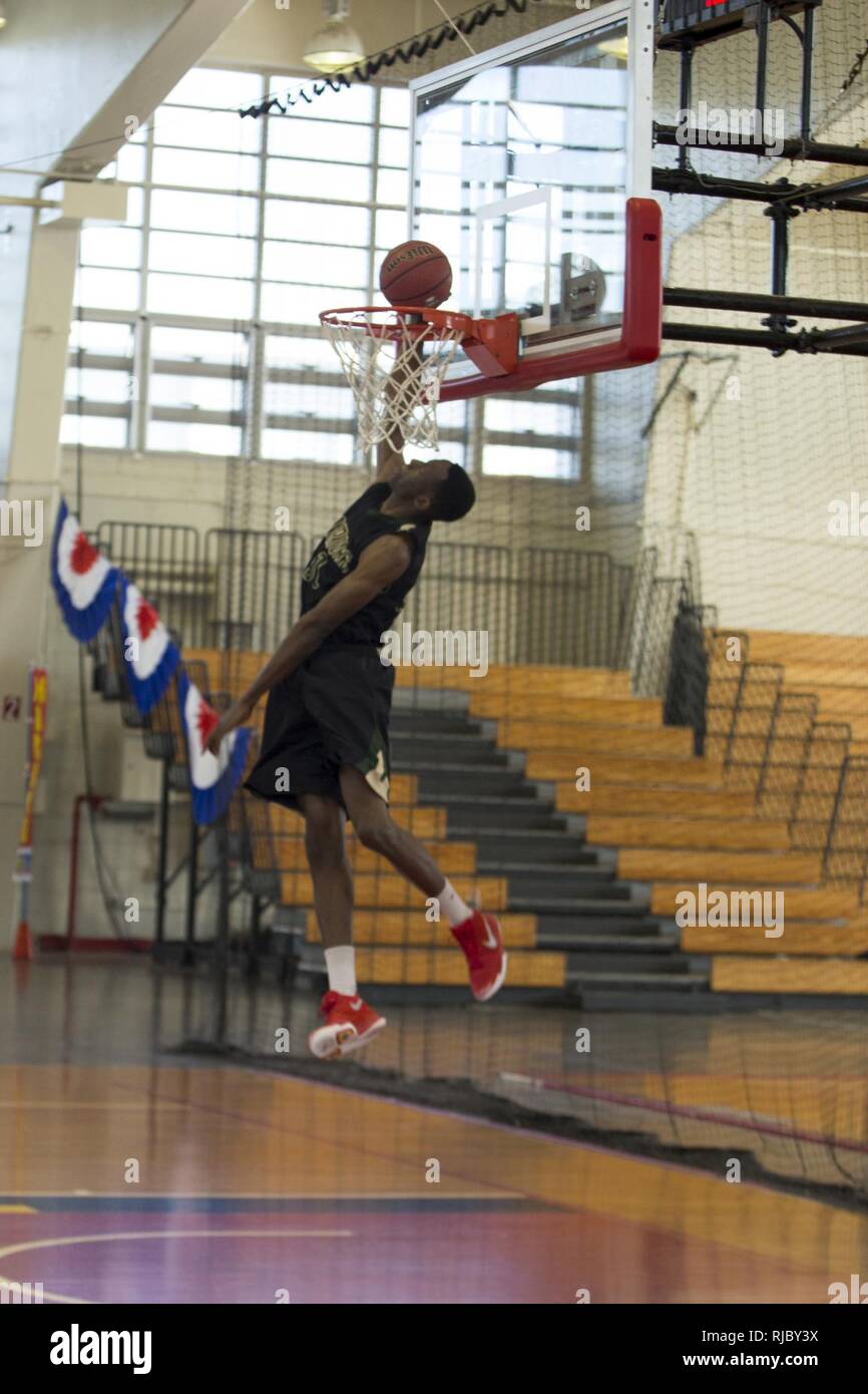 CAMP FOSTER, OKINAWA, Japan- Cpl. Sean Stewart dunks the ball during ...