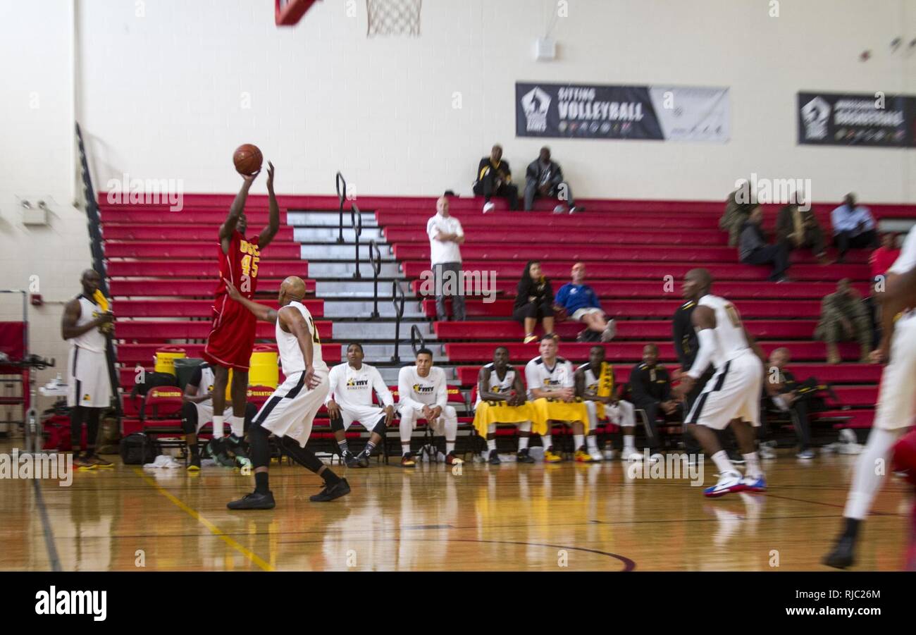 Lance Corporal Sean Stewart attempts a three-point shot during the ...