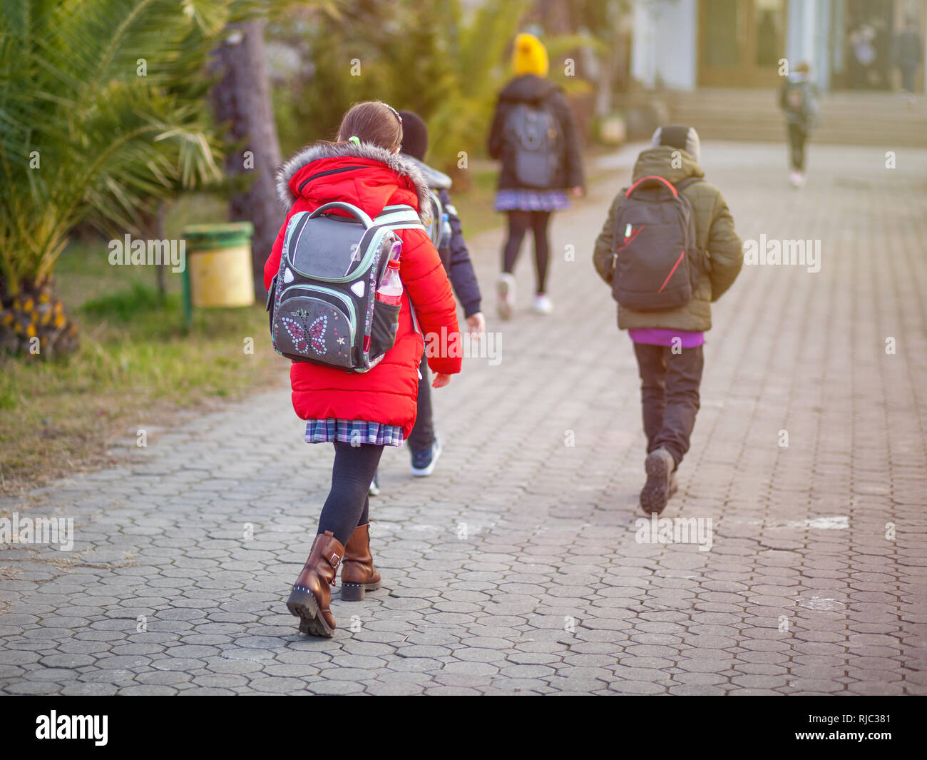 Group of kids going to school together, back to school, winter time Stock Photo - Alamy