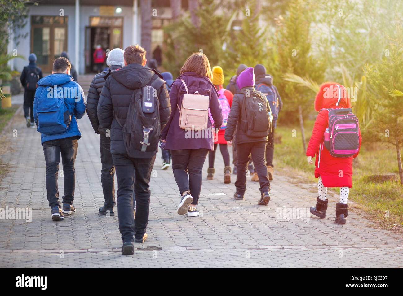 Group of kids going to school together, back to school, winter time Stock Photo - Alamy