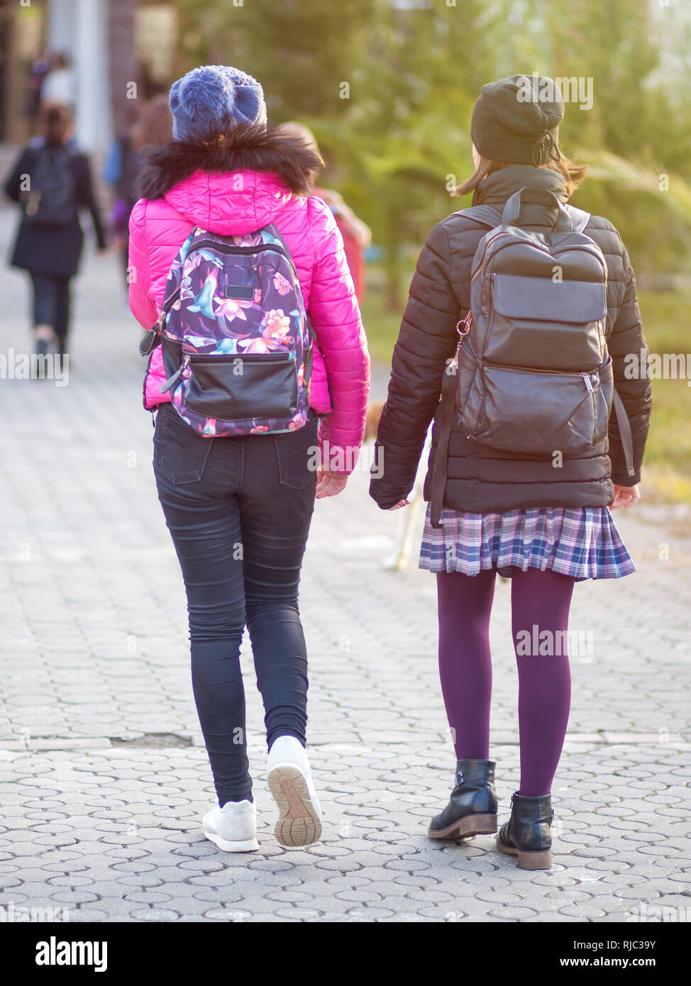 Group of kids going to school together, back to school, winter time Stock Photo - Alamy