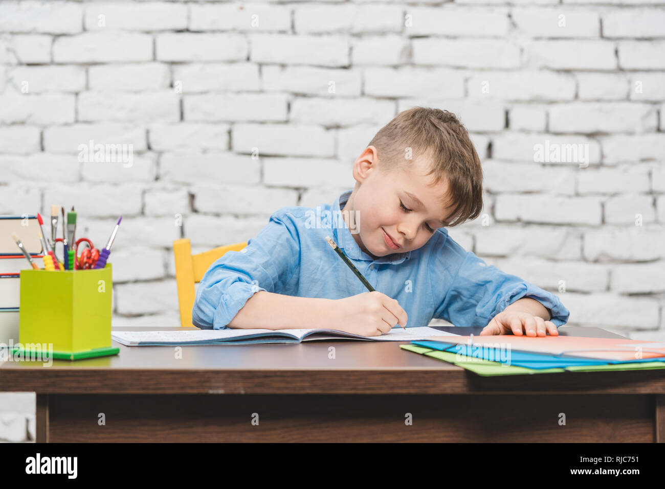Young boy learning for school Stock Photo - Alamy