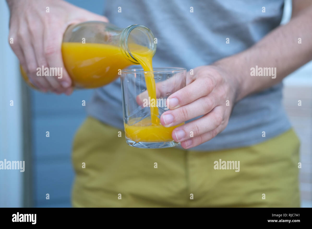 Pouring orange juice bottle pouring hi-res stock photography and images ...