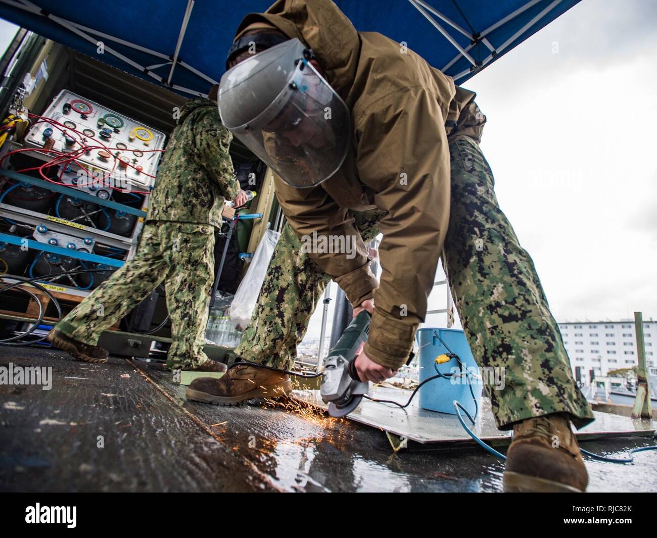 U.S. Navy Builder 2nd Class Sean McHugh, assigned to Underwater ...