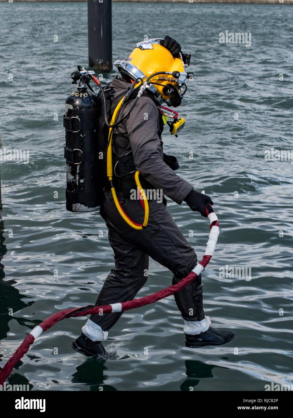U.S. Navy Construction Mechanic 2nd Class Ryan Filo, assigned to ...