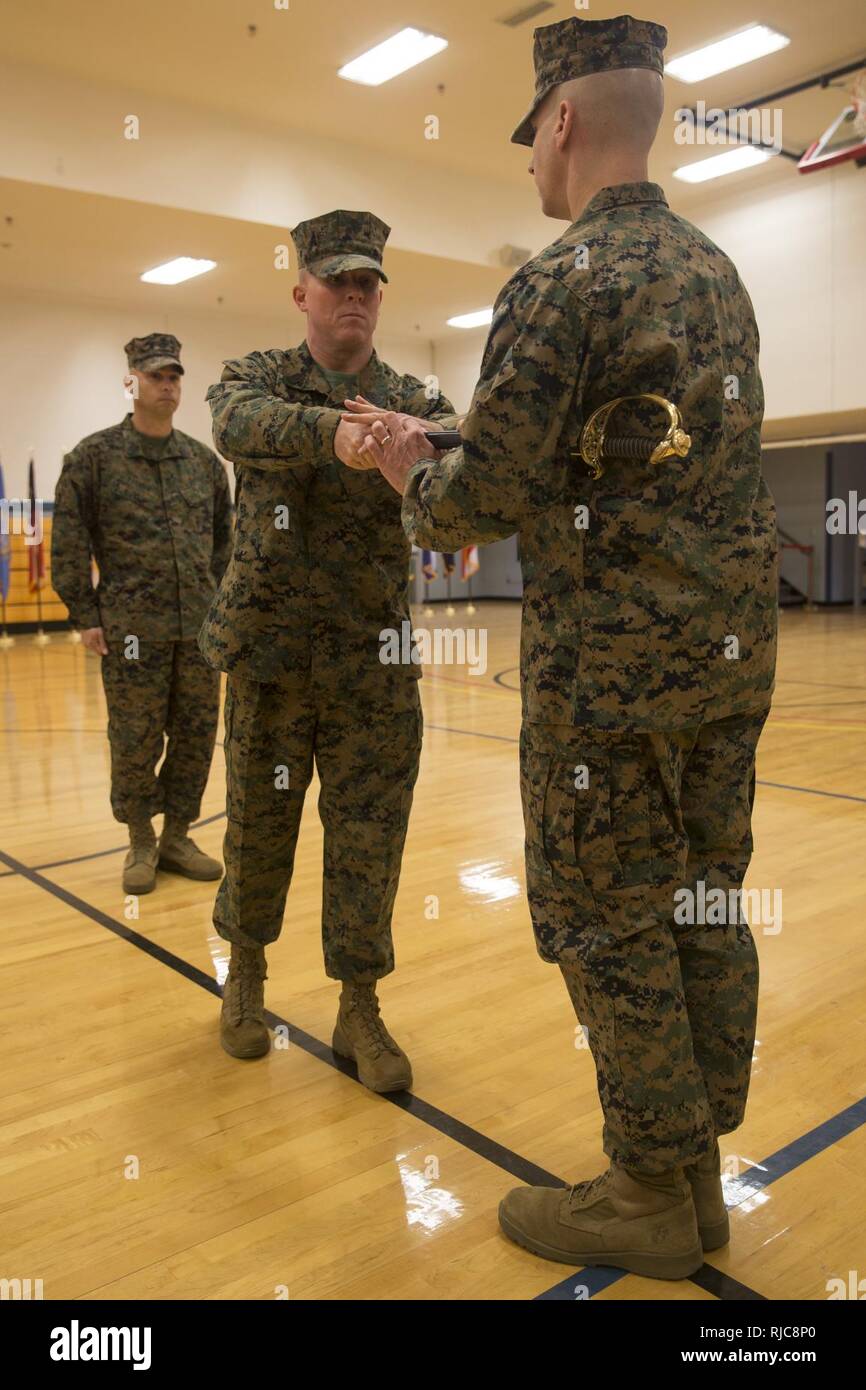 U.S. Marines Corps Sgt. Maj. Dylan W. Goldman, center, off going ...