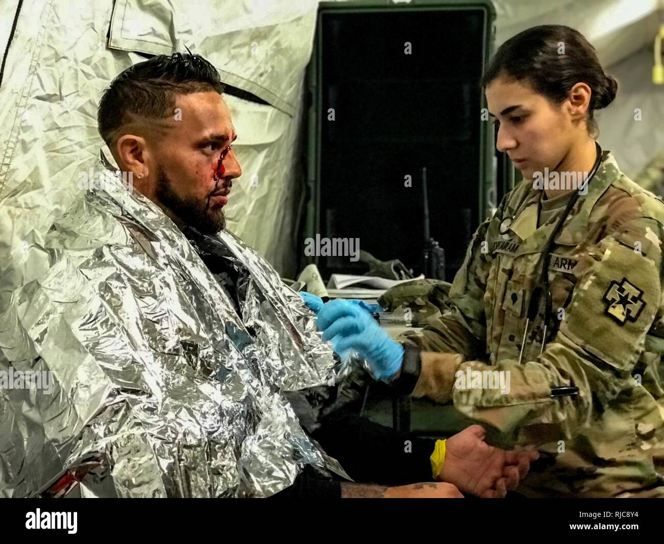 U.S. Army Soldier triage simulated casualties during a Mass Casualty ...