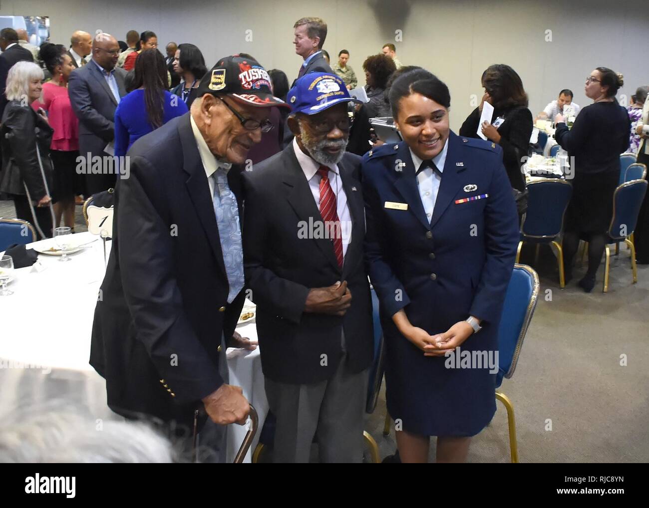 Air Force 2nd Lt. Jasmine Toye poses for a photo with special guests ...