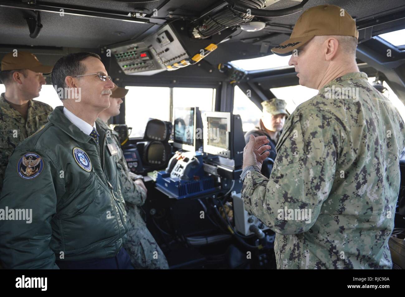 VIRGINIA BEACH, Va. (Jan. 10, 2018) Capt. Ty Britt, right, commander of ...