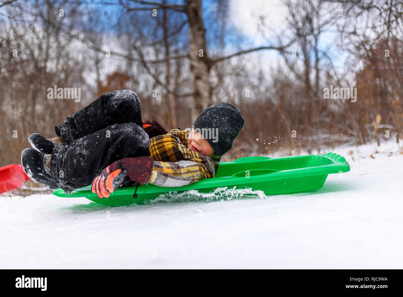 Children on sledge back view hi-res stock photography and images - Alamy