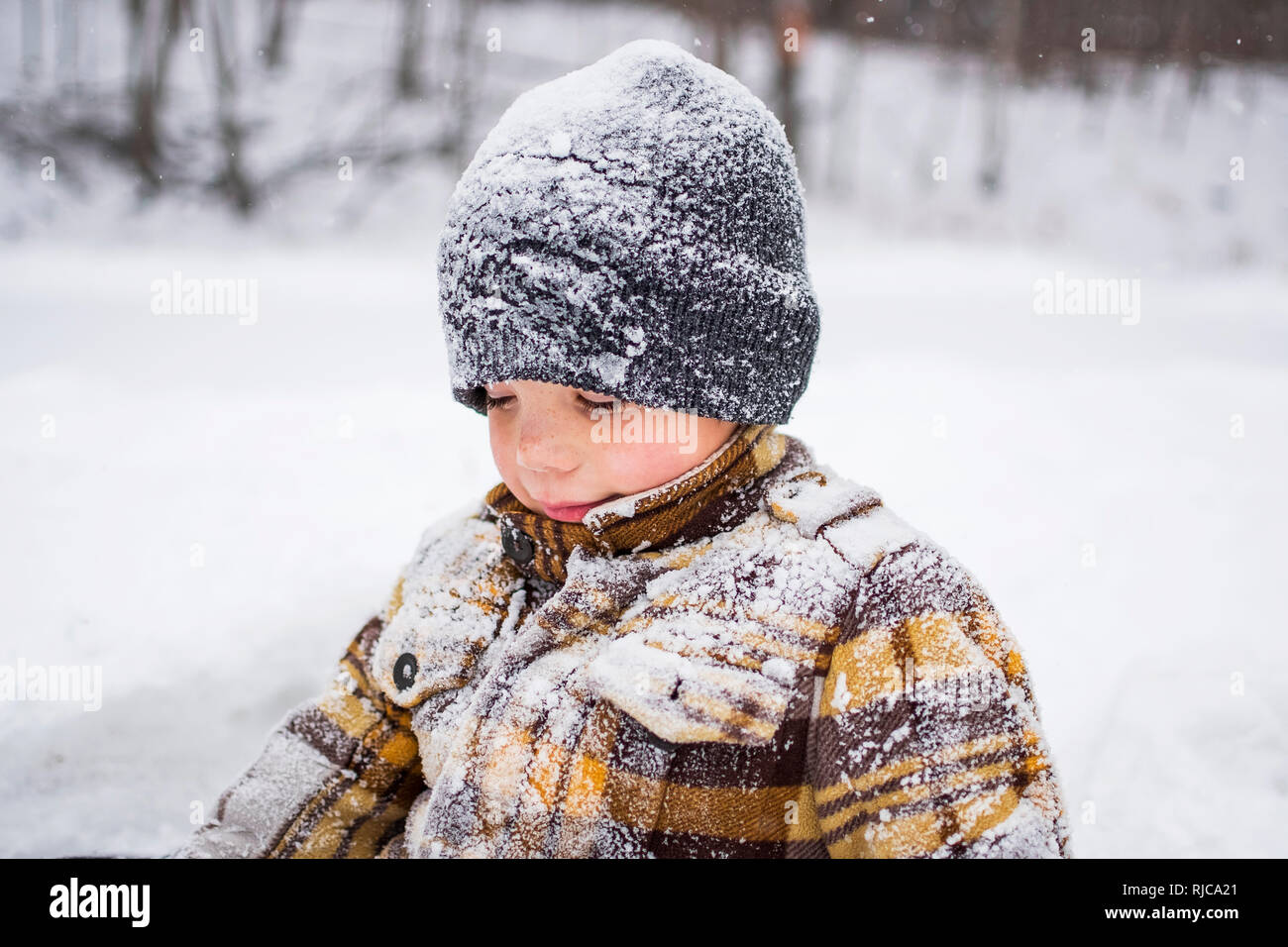 A boy playing in the snow hi-res stock photography and images - Alamy