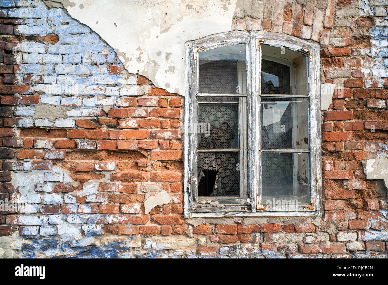 Old brick wall and wooden broken window. A broken window in an old ... Old brick wall and wooden broken window. A broken window in an old ...