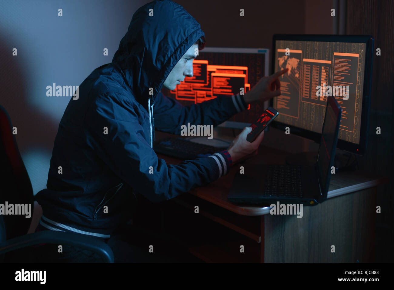 Hacker man trying breach security hi-res stock photography and images ...