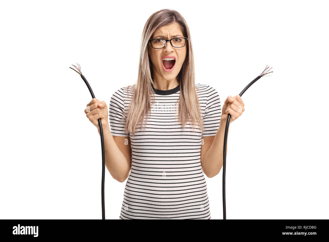 Angry woman screaming with a broken cable in her hands isolated on ...