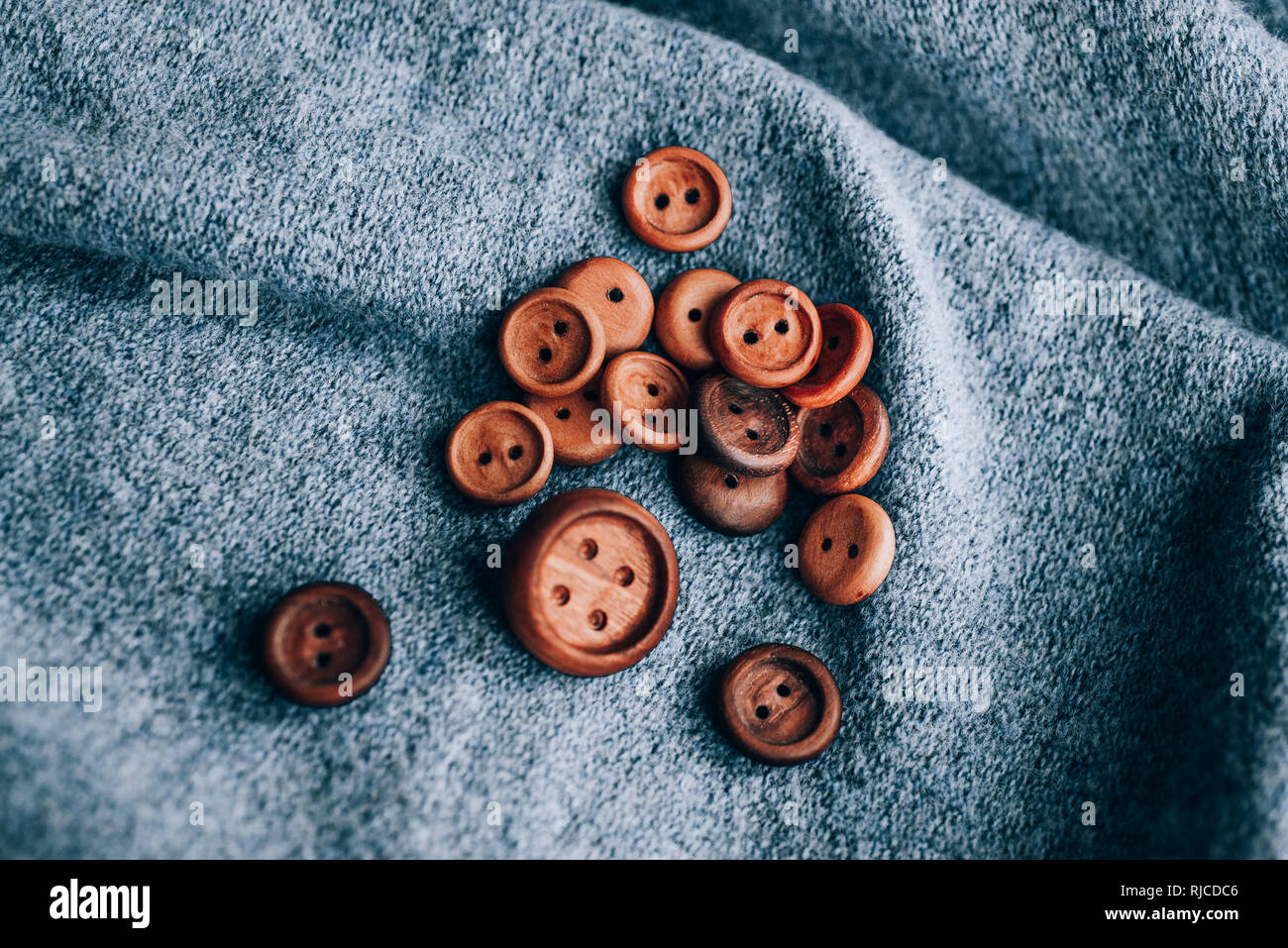 wooden buttons that are placed randomly on a gray background Stock ...