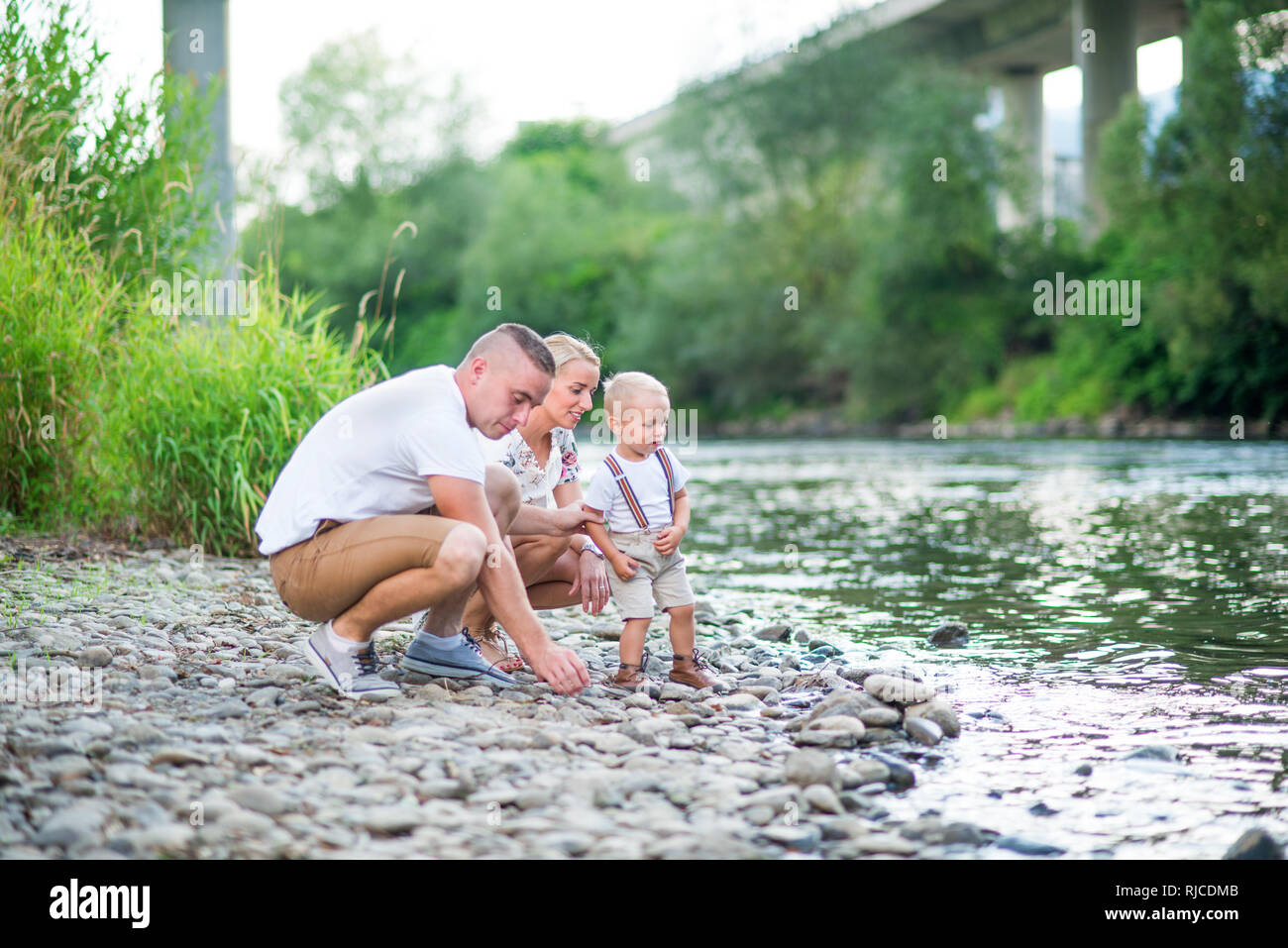 Family playing together in a river hi-res stock photography and images ...