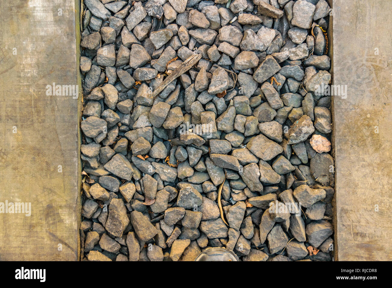 Top view close up photo old Railway with stone pattern and wooden lines ...