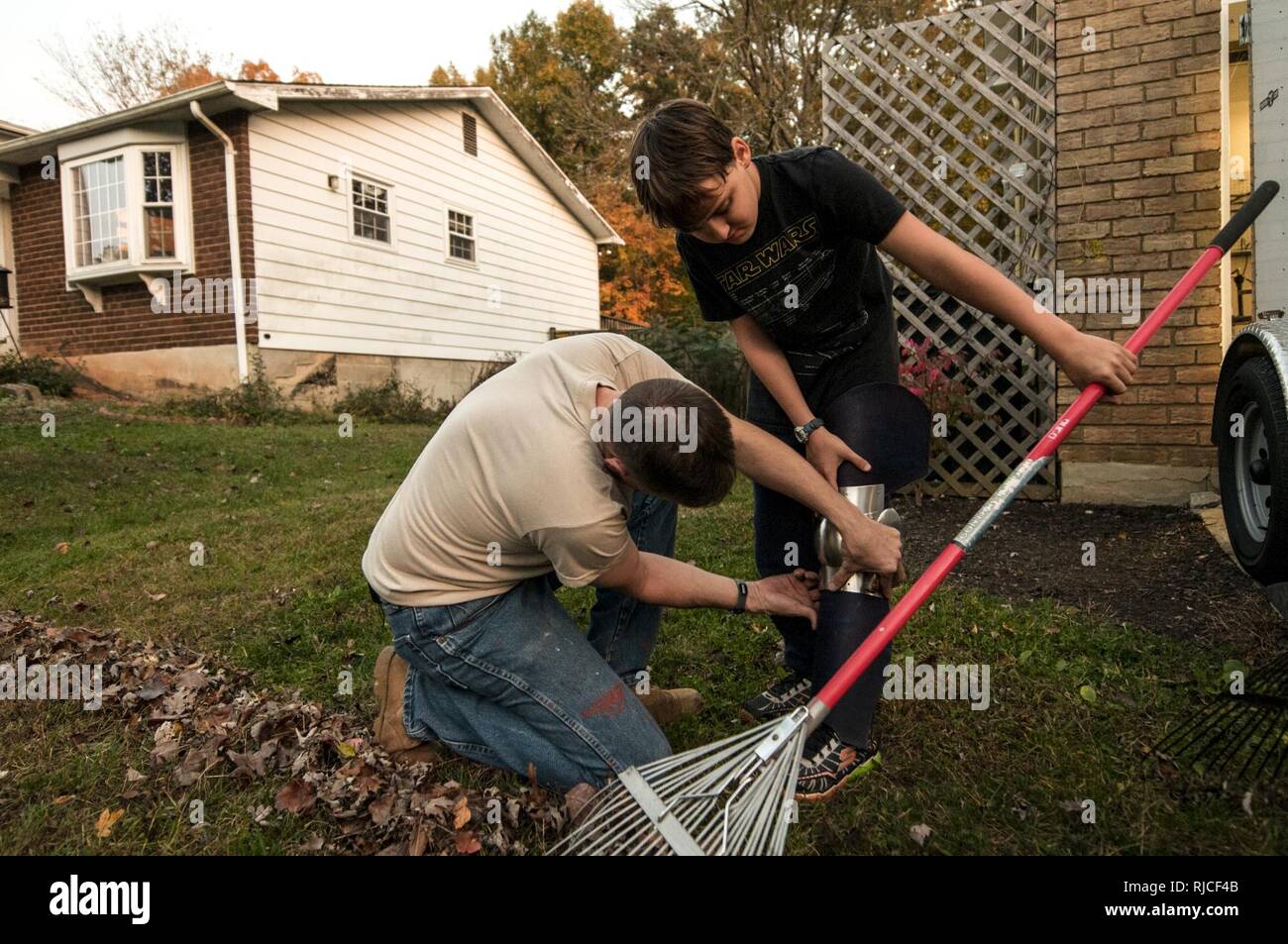 Gene Taylor, Society for Creative Anachronism member, holds leg armor ...