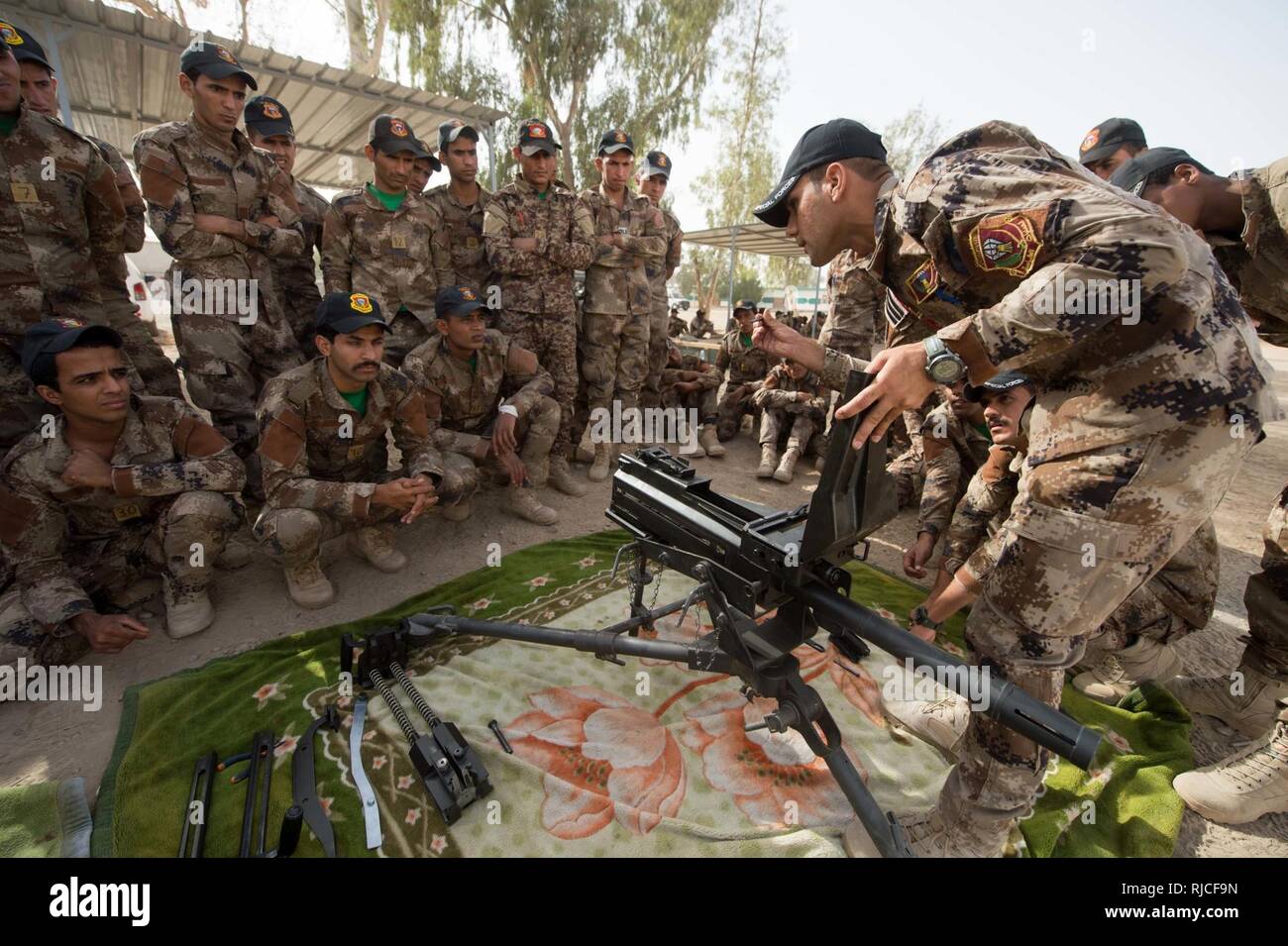An Iraqi Counter-Terrorism Service instructor demonstrates how to ...