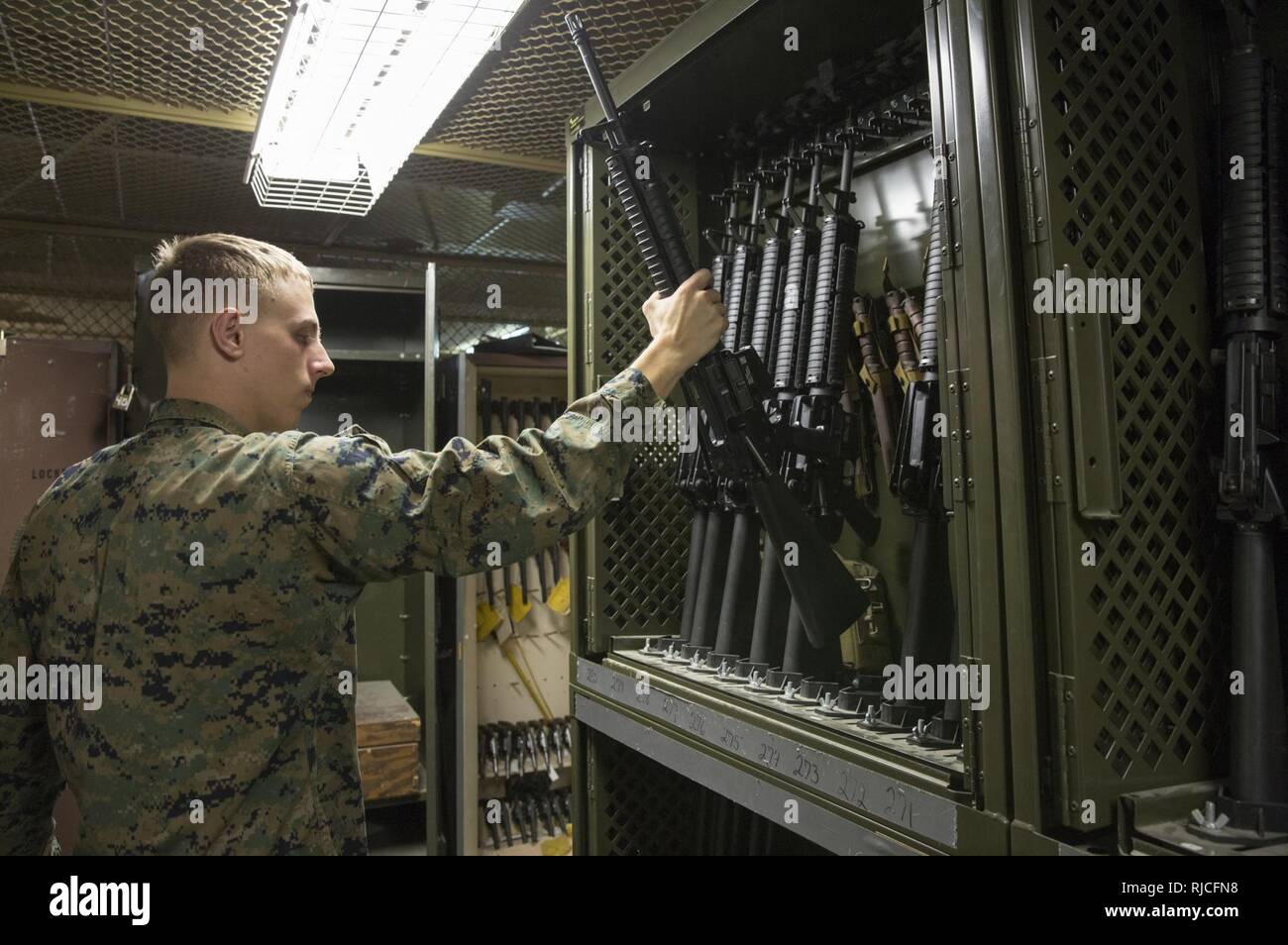 LCpl. Jacob Cooper, Victorville, Calif., a 2111 Armorer with ...
