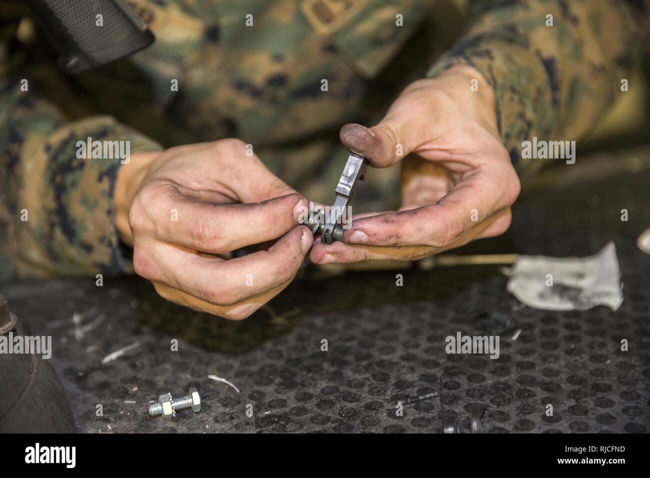 LCpl. Jacob Cooper, Victorville, Calif., a 2111 Armorer with ...