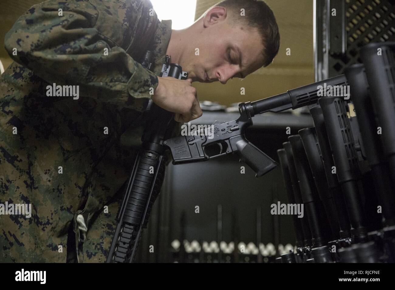 LCpl. Jacob Cooper, Victorville, Calif., a 2111 Armorer with ...