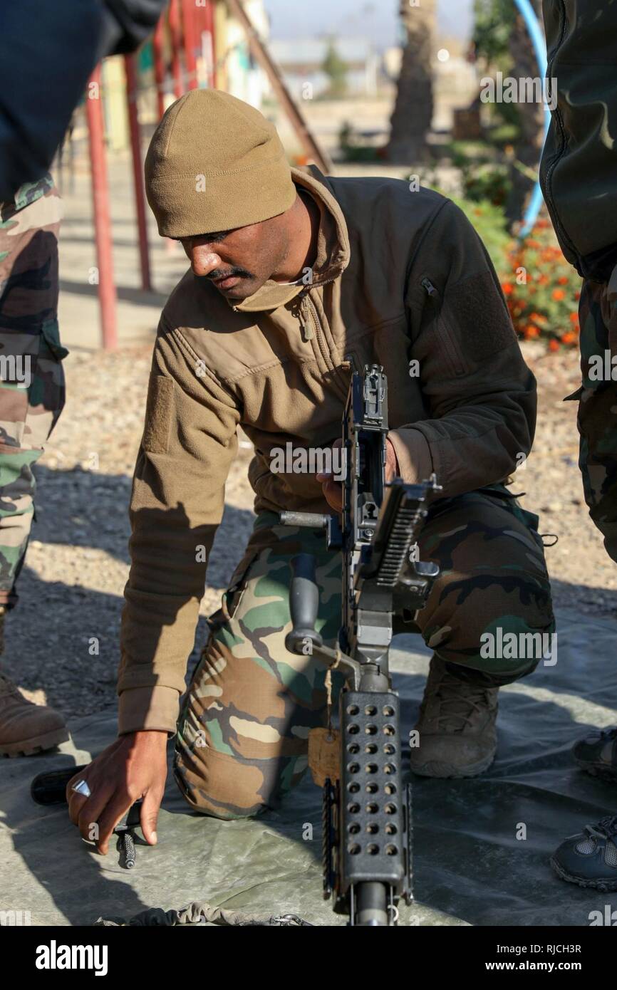 An Iraqi Special Forces heavy weapons instructor provides guidance on ...