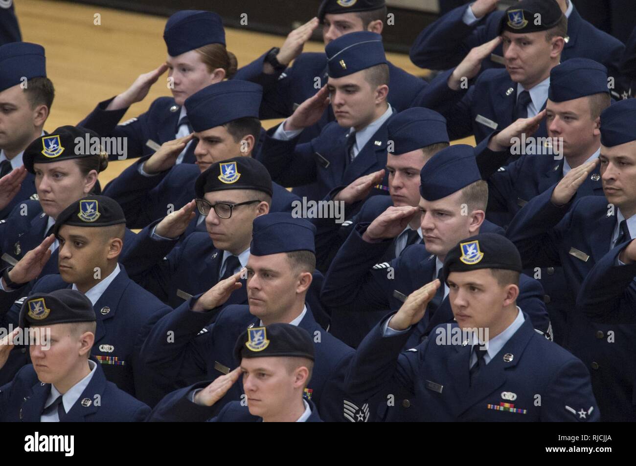 Members from the 460th Mission Support Group salute during the 460th ...