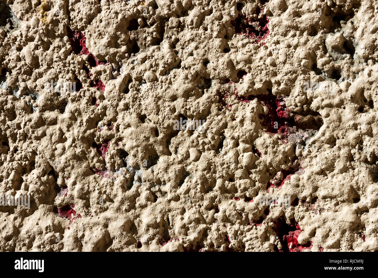Gray and red plaster street wall texture background Stock Photo - Alamy