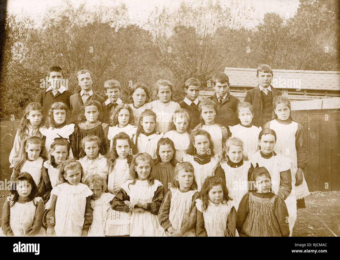 Group photo of children, the girls wearing smocks Stock Photo - Alamy