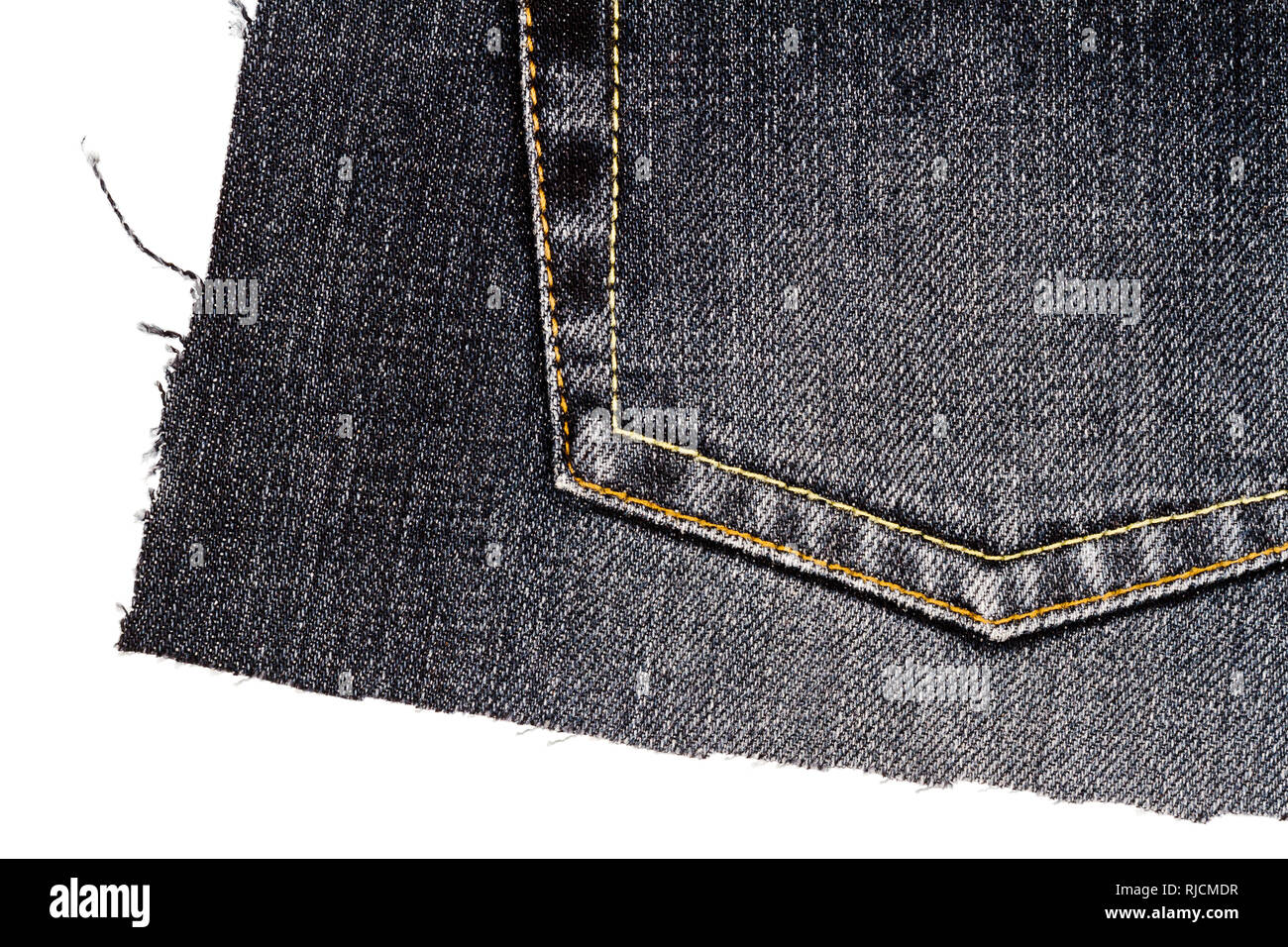 Piece of black jeans fabric with a back pocket isolated on white ...