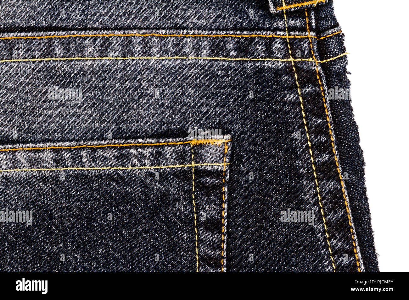 Piece of black jeans fabric with a back pocket isolated on white ...