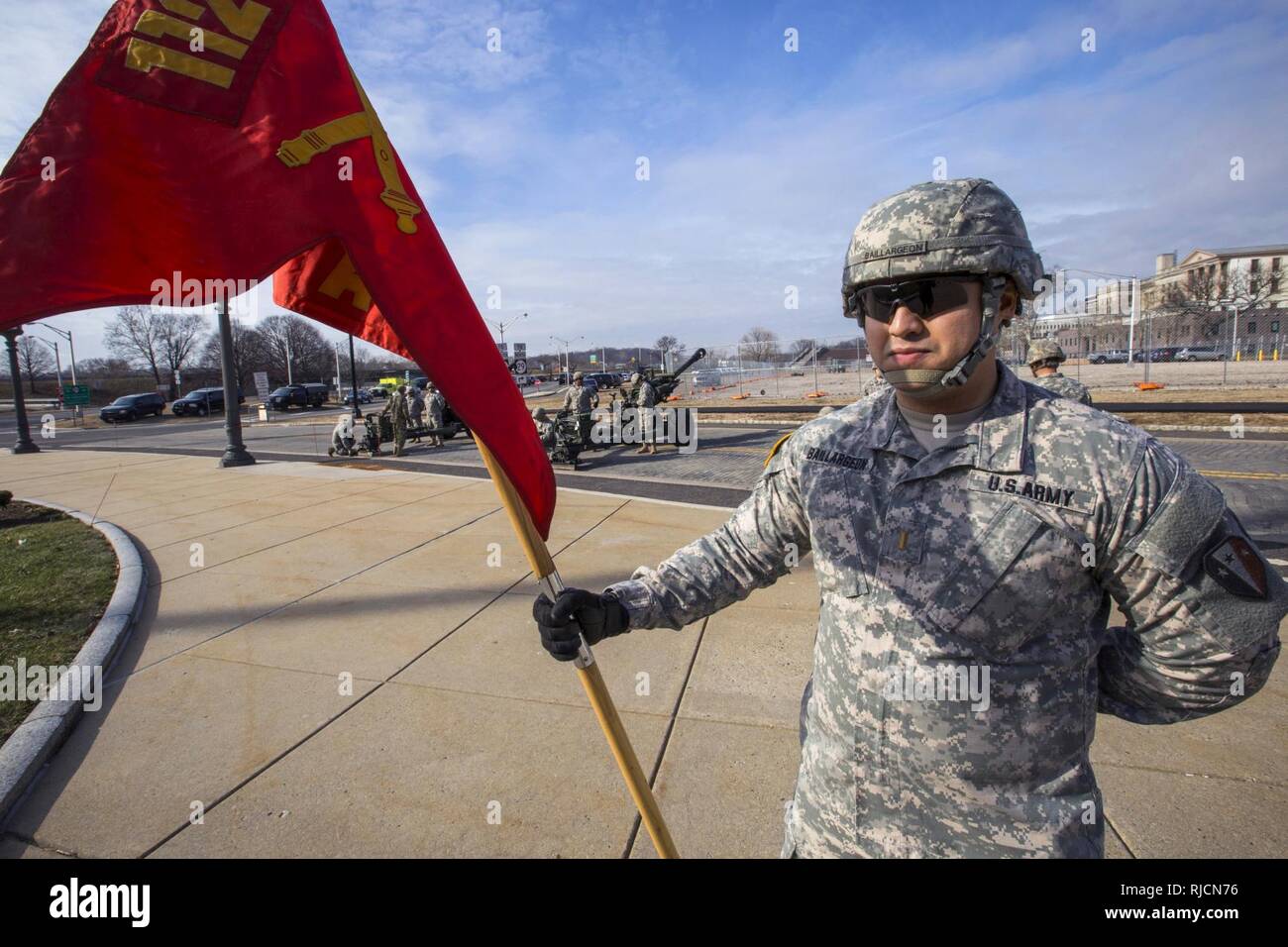 U.S. Army 2nd Lt. Christopher Baillargeon, holds the guidon for A Battery, 3-112th Field ...
