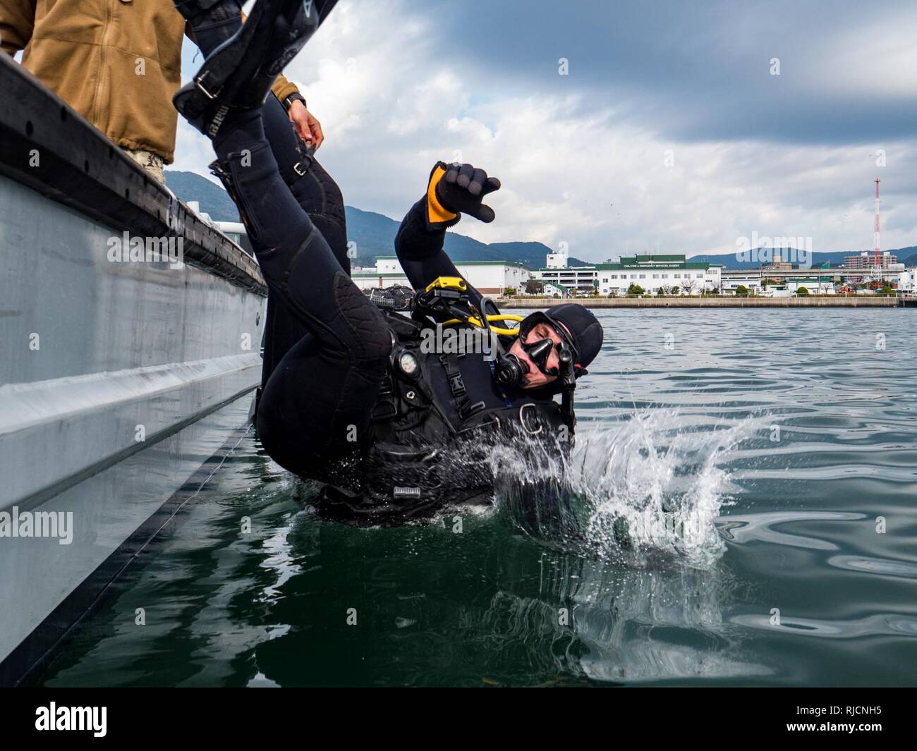 U.S. Navy Senior Chief Construction Electrician Adam Winters, assigned ...