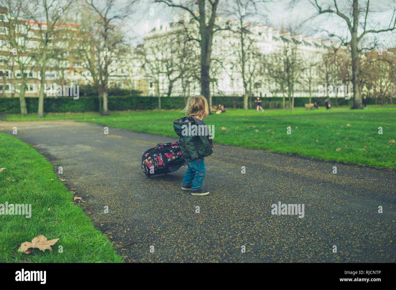 Child pulling suitcase hi-res stock photography and images - Alamy