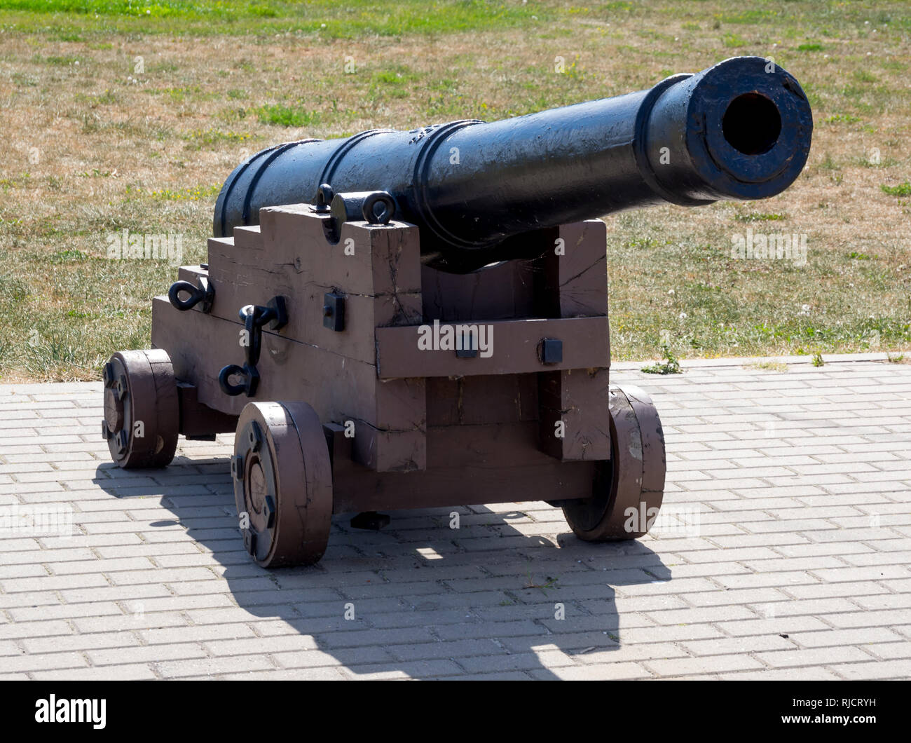 Old ship cannon on a wooden carriage Stock Photo - Alamy