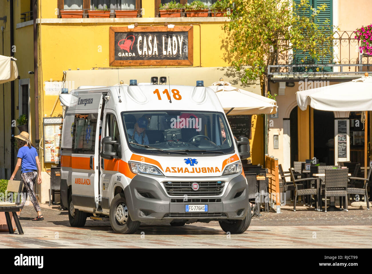 GARDA, ITALY - SEPTEMBER 2018: Emergency ambulance parked in a square ...