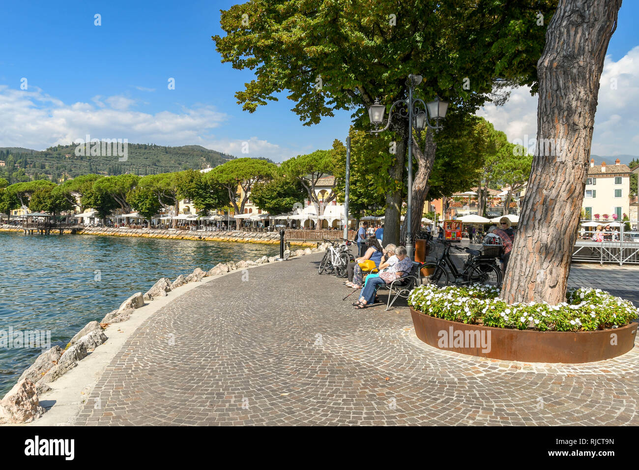 GARDA, ITALY - SEPTEMBER 2018: Scenic view of the promenade around the ...