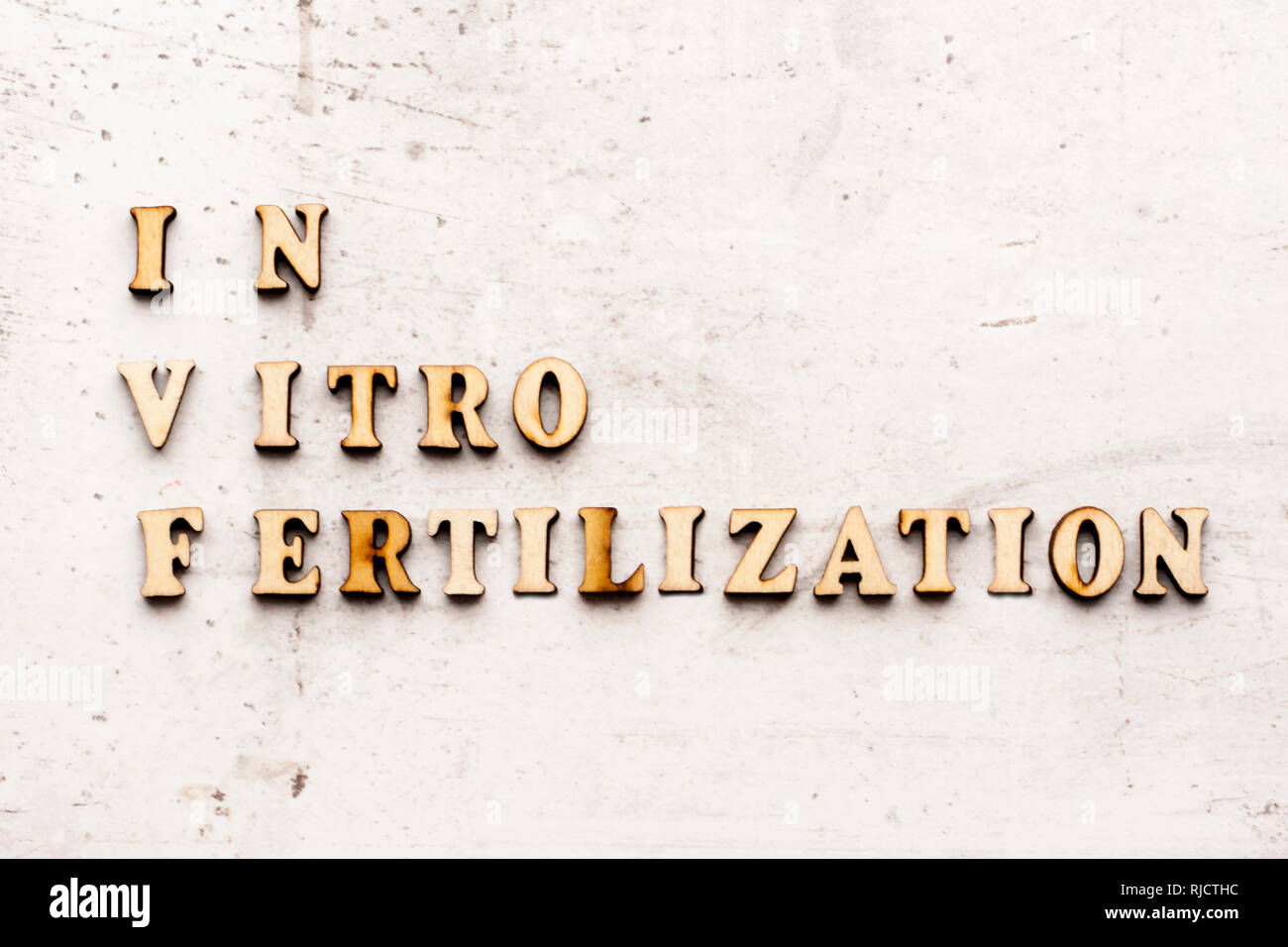 IVF (In Vitro Fertilization) acronym (abbreviation) on light background ...