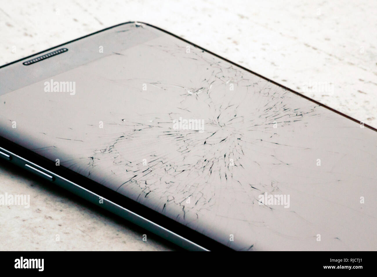 Broken touch screen of a black smartphone Stock Photo - Alamy
